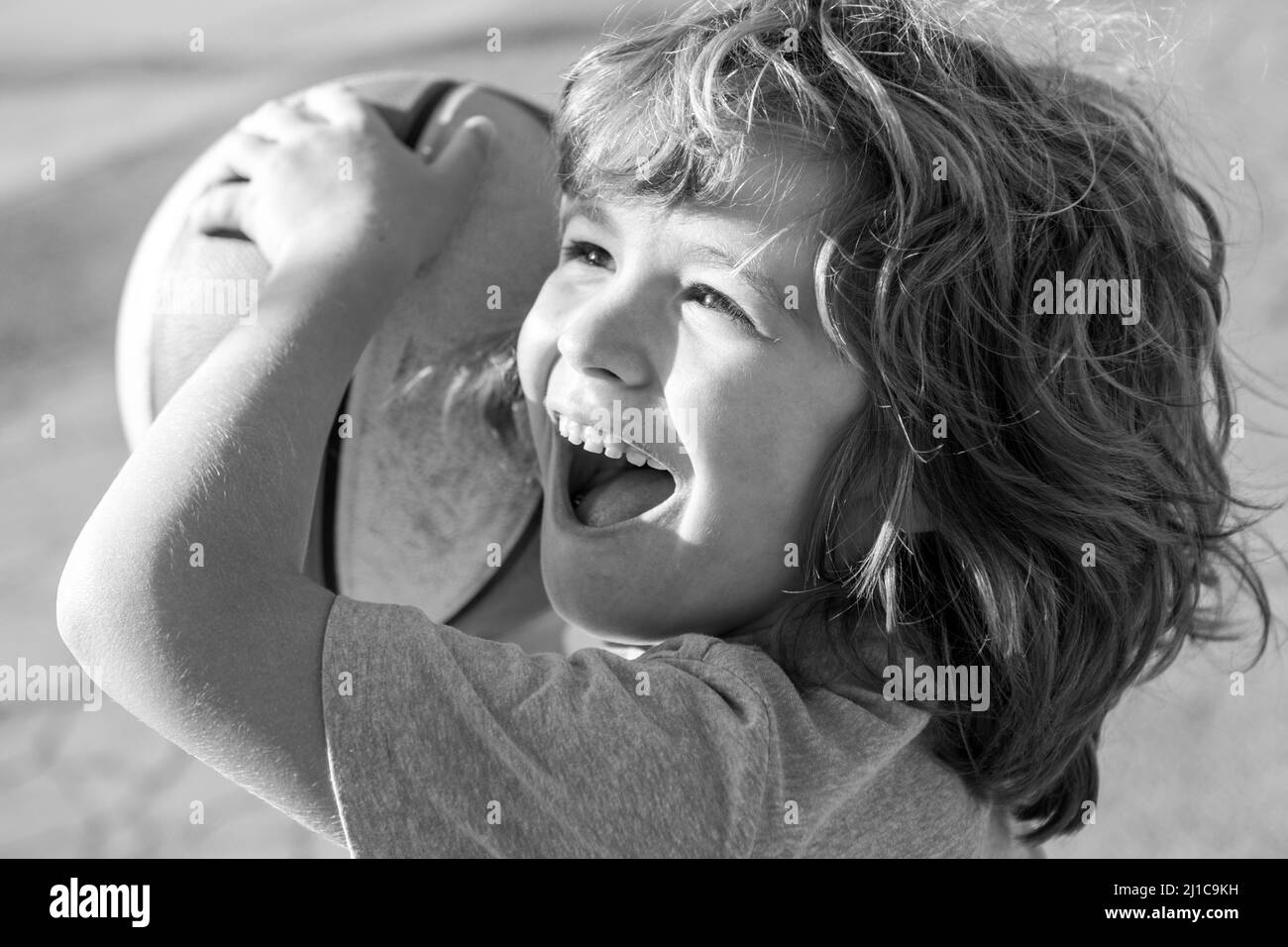 Cute smiling boy plays basketball. Kid sportsman Stock Photo - Alamy