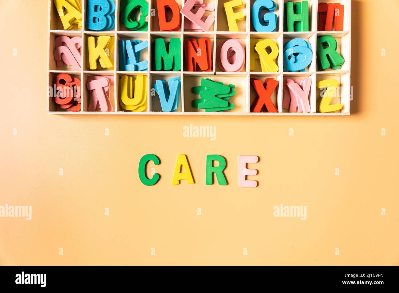 the word care represented as a concept by wooden color letters, from ...