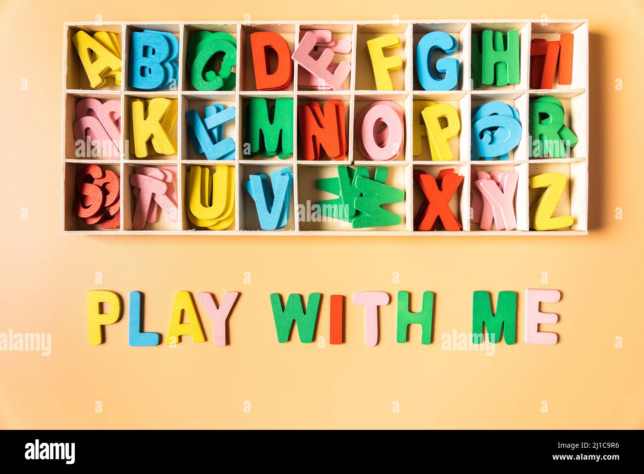 the expression play with me, represented as a concept by wooden color ...