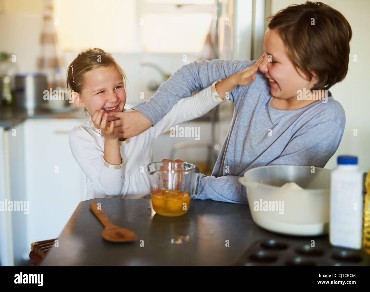 Adding some fun to the mix. Cropped shot of two young siblings having ...