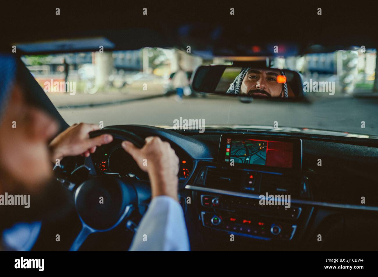 Saudi man driving a car and feeling good Stock Photo - Alamy