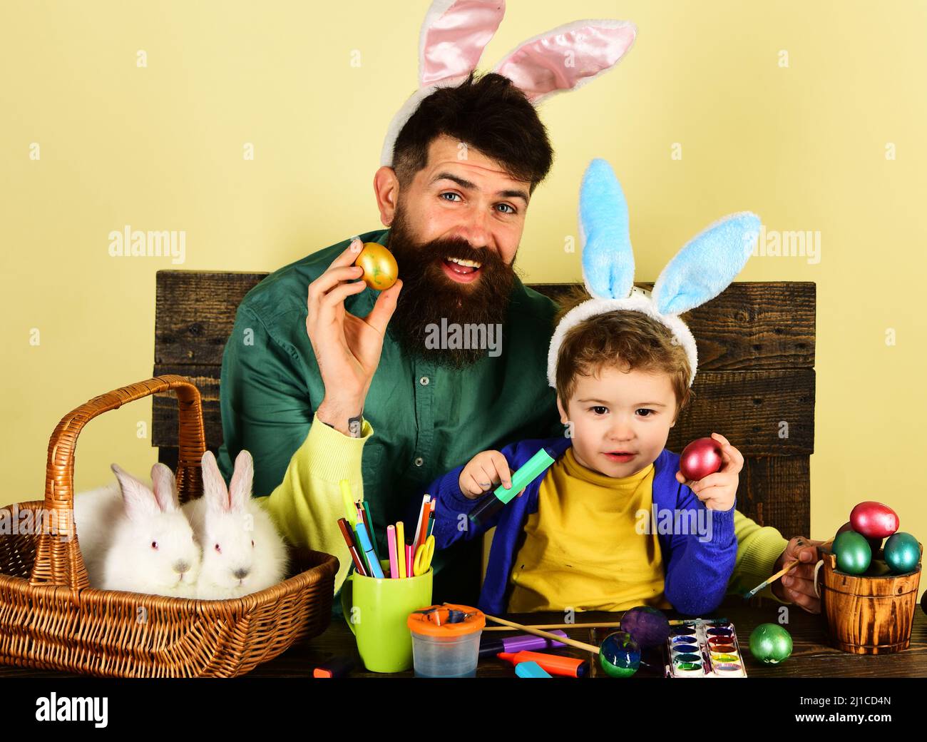 Father and son with painted Easter eggs. Easter ideas for decorating ...