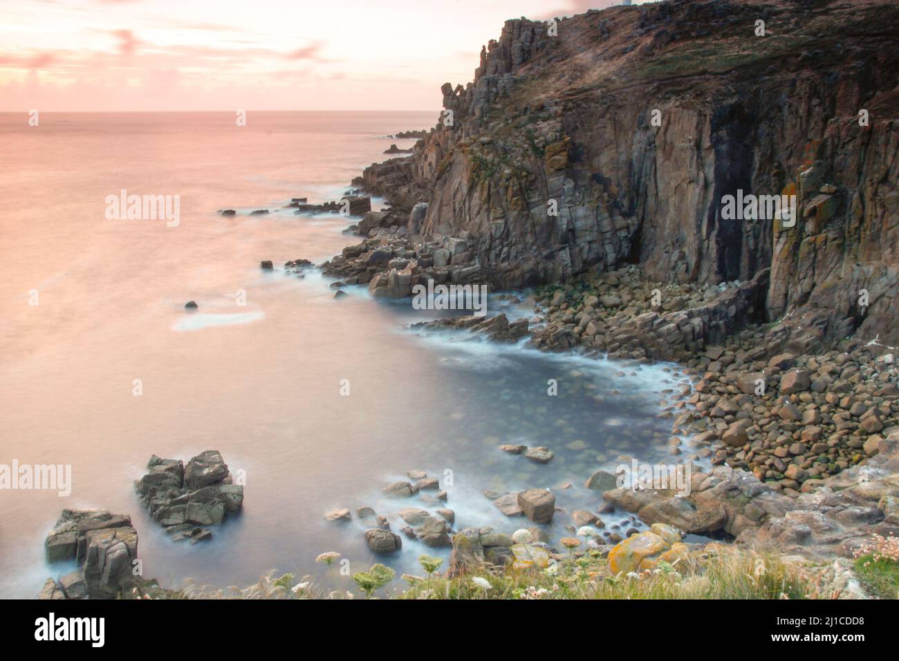 An aerial view of the cliffy seashore at sunset in the UK Stock Photo ...