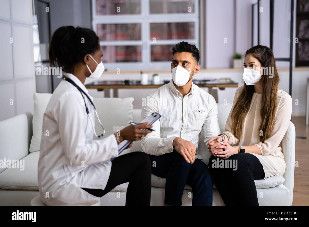 Pregnant Couple And Medical Doctor At Home Pregnancy test Stock Photo ...