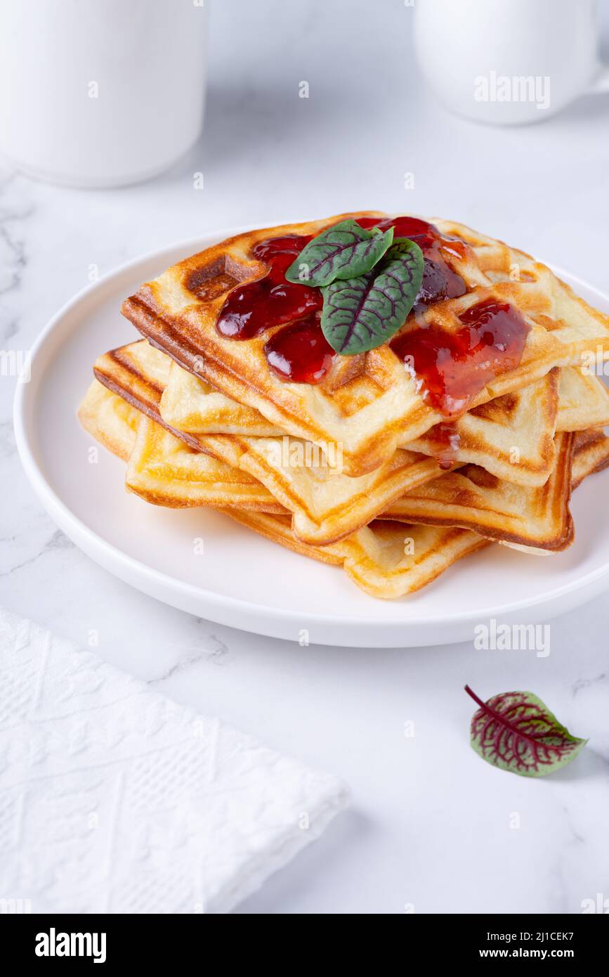 Homemade delicious belgian waffles on the white table Stock Photo - Alamy