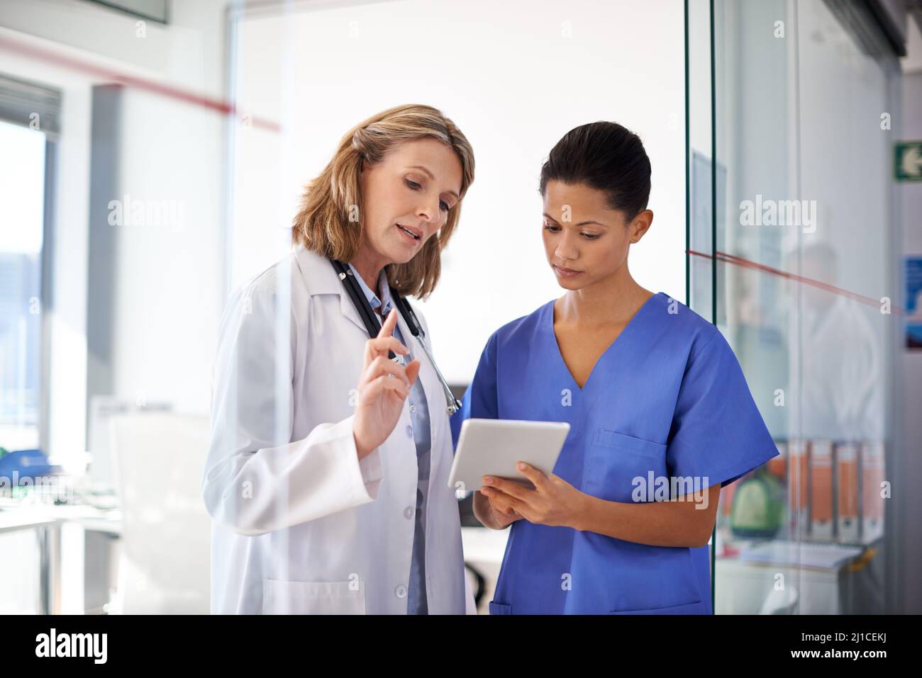 I want you to do the following.... Shot of a female doctor giving a ...