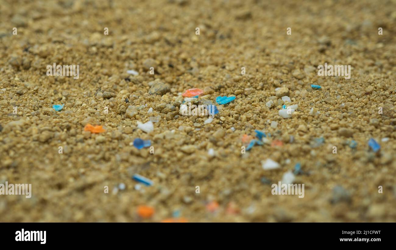 Microplastics in the sand on the beach. Concept of global warming and ...