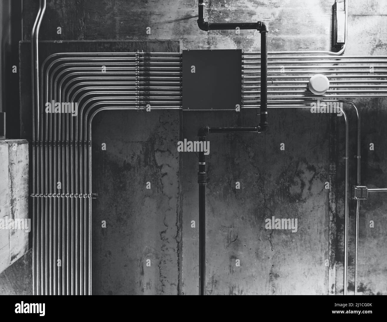 A view of tubes for electrical wiring in black and white Stock Photo ...