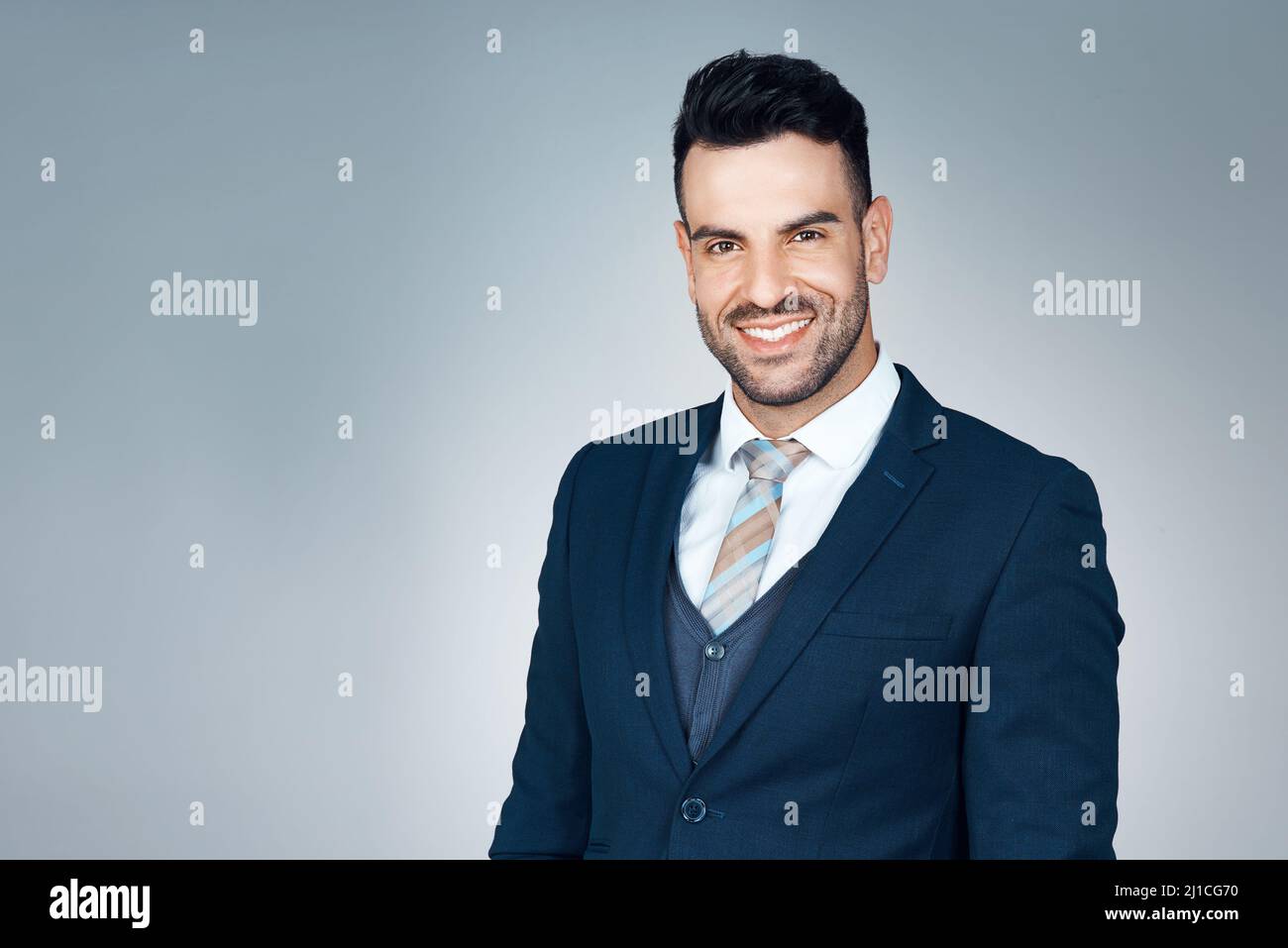 Confidence is his strongest trait. Studio portrait of a handsome young ...