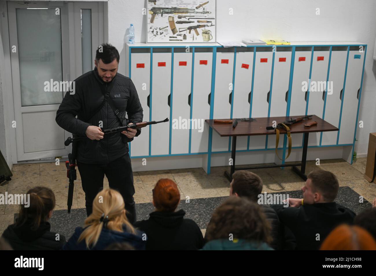 Civilian volunteers hoping to join local territorial defense forces in Lviv are trained in ...