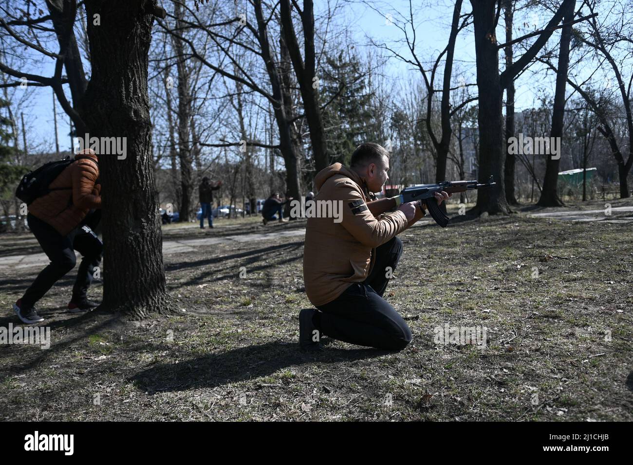 Civilian volunteers hoping to join local territorial defense forces in Lviv are trained in ...