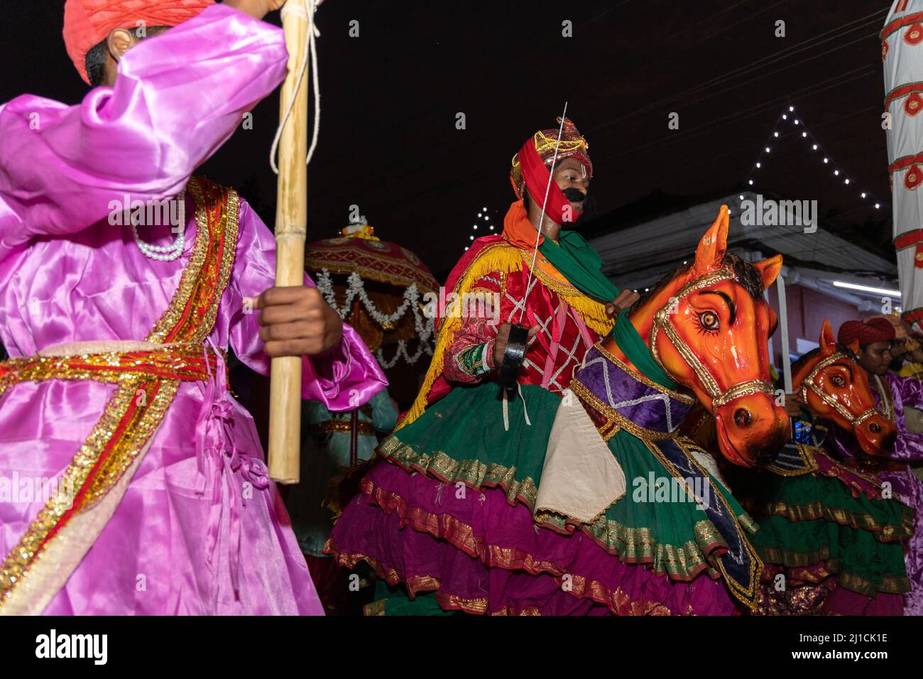 Group of men dressed as horse mounted soldiers, in colourful attire ...