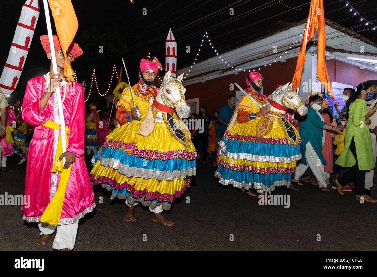Group of men dressed as horse mounted soldiers, in colourful attire ...