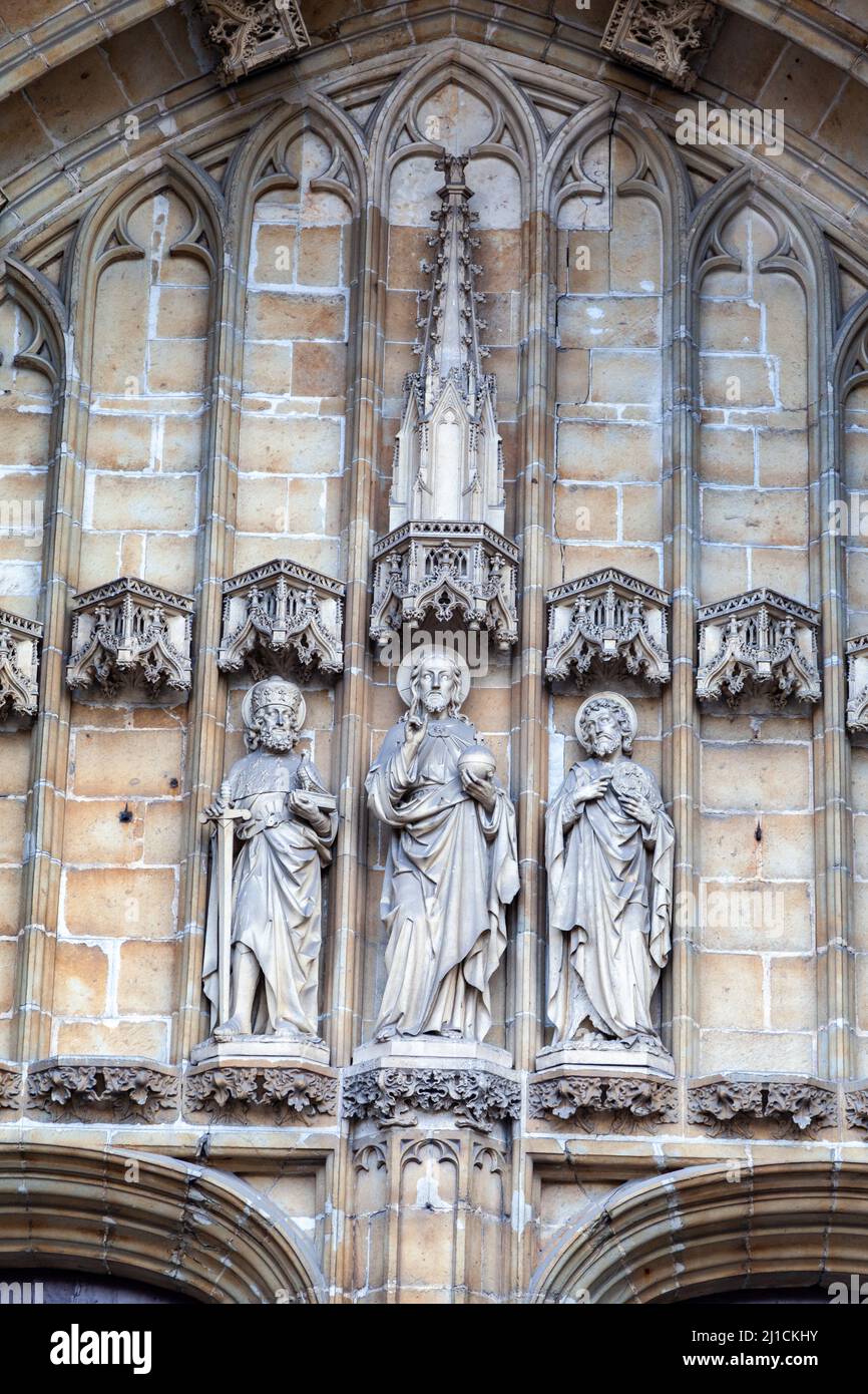 A vertical shot of statues on the facade of Saint Bavo Cathedral in ...