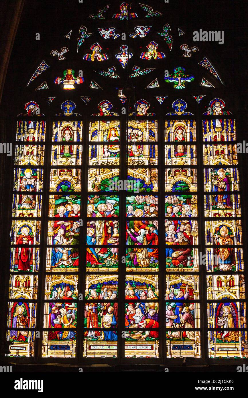 A vertical shot of medieval stained glass window of Saint Bavo ...