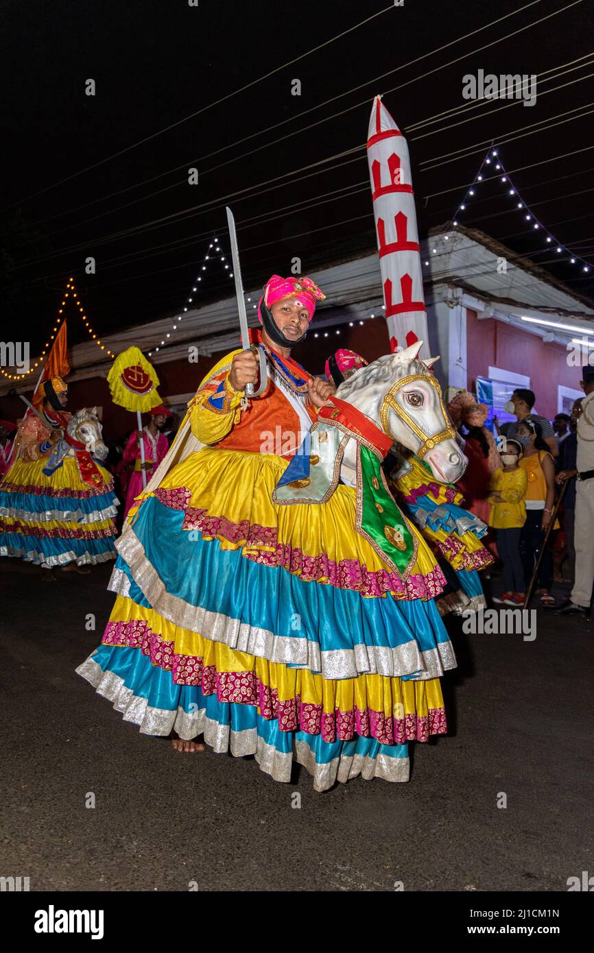 Group of men dressed as horse mounted soldiers, in colourful attire ...