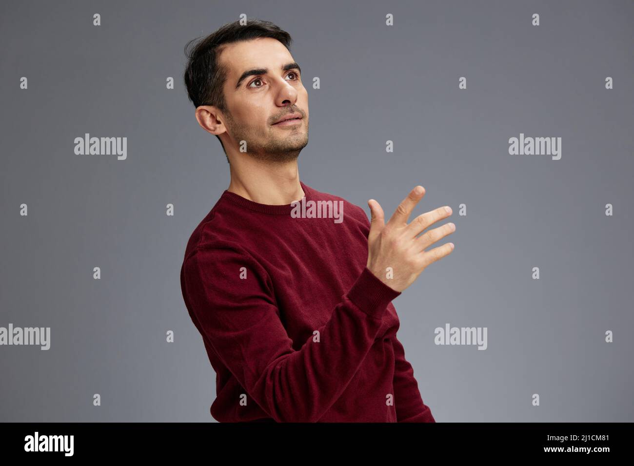 successful man in a red sweater hand gesture posing self confidence ...