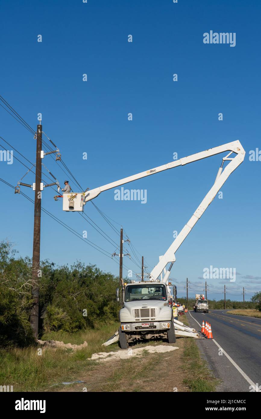 An electrical construction worker or lineman working in an elevated ...