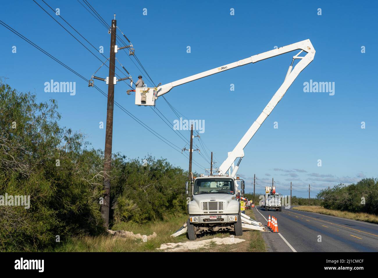 An electrical construction worker or lineman working in an elevated ...