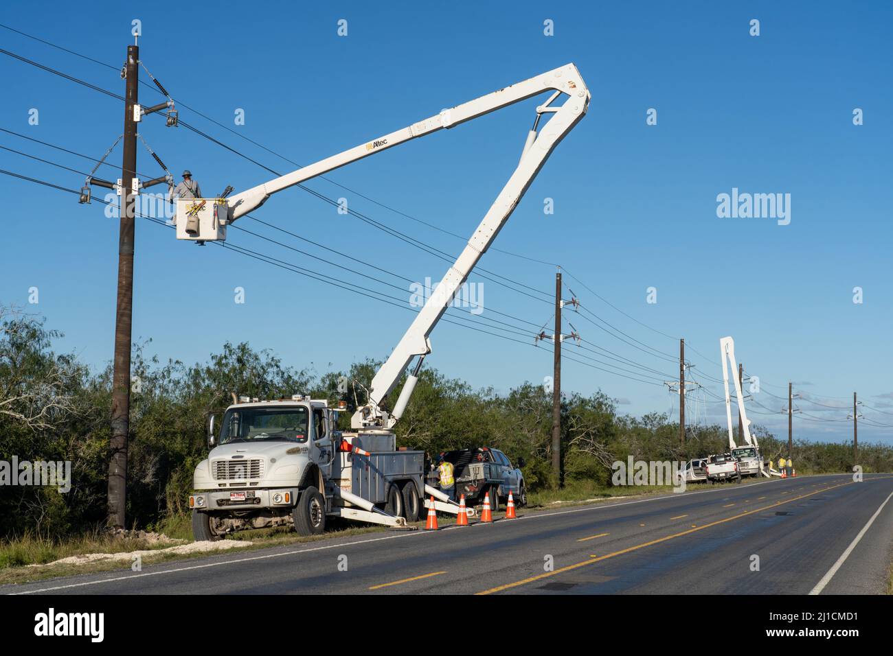 An electrical construction worker or lineman working in an elevated ...
