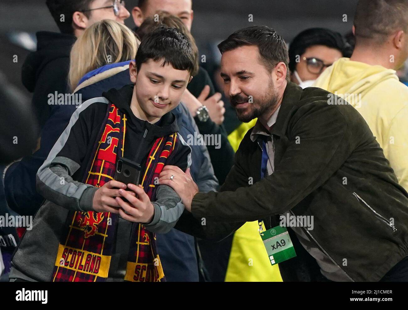 Actor Martin Compston takes a selfie with a fan during the ...