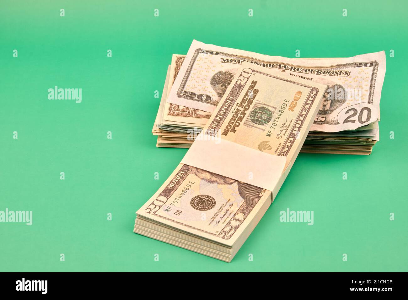 A pile of dollars on a green table. Photograph in horizontal format ...