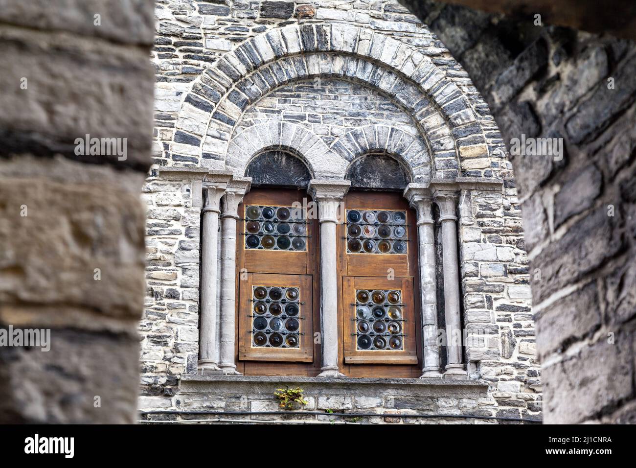 The facade of an old building with arched windows in Ghent, Belgium ...
