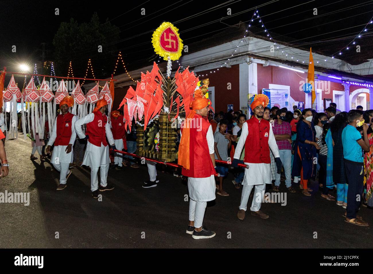 Photo / idol of village deity carried in palanquin by group of men at ...