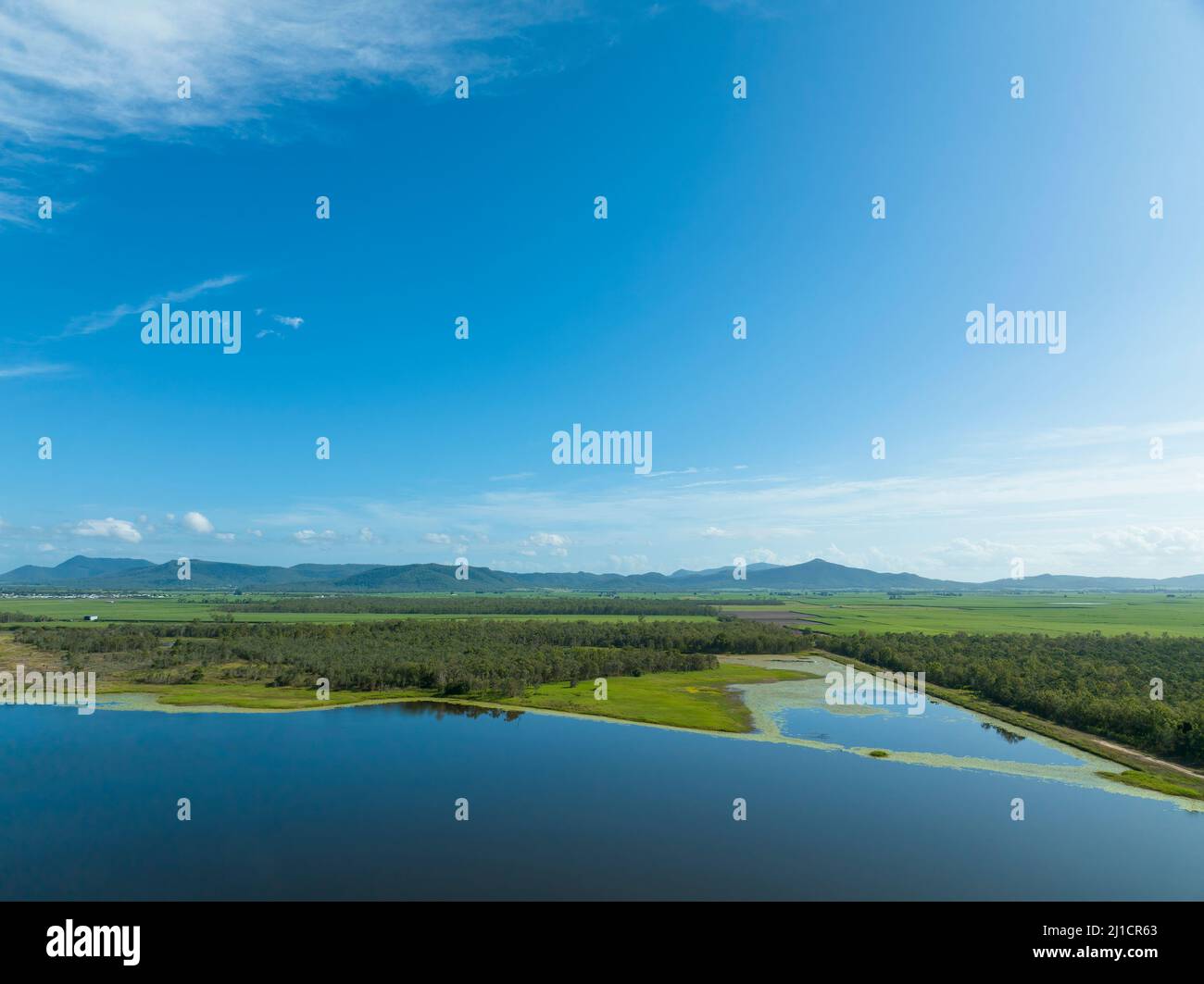 Drone aerial view of a dam and the sugarcane farmlands beyond. Dam ...