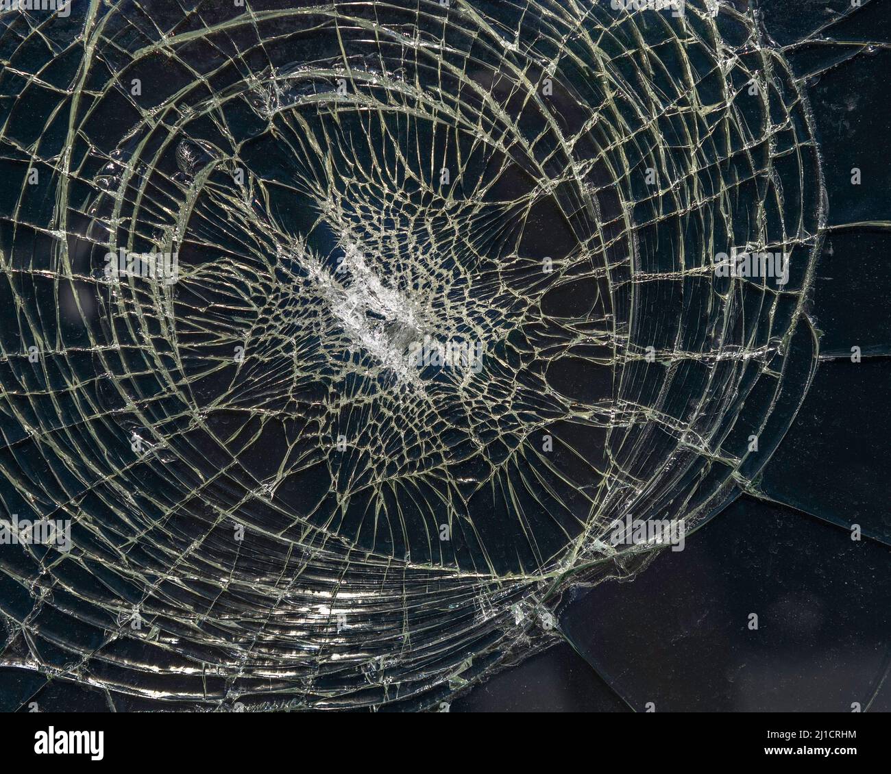 Close up of a broken and cracked glass screen Stock Photo - Alamy