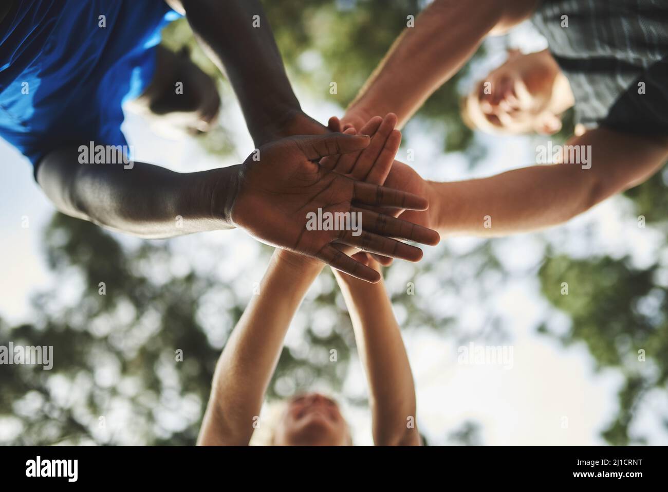 Its easier when you have support. Low angle shot of a group of sporty ...