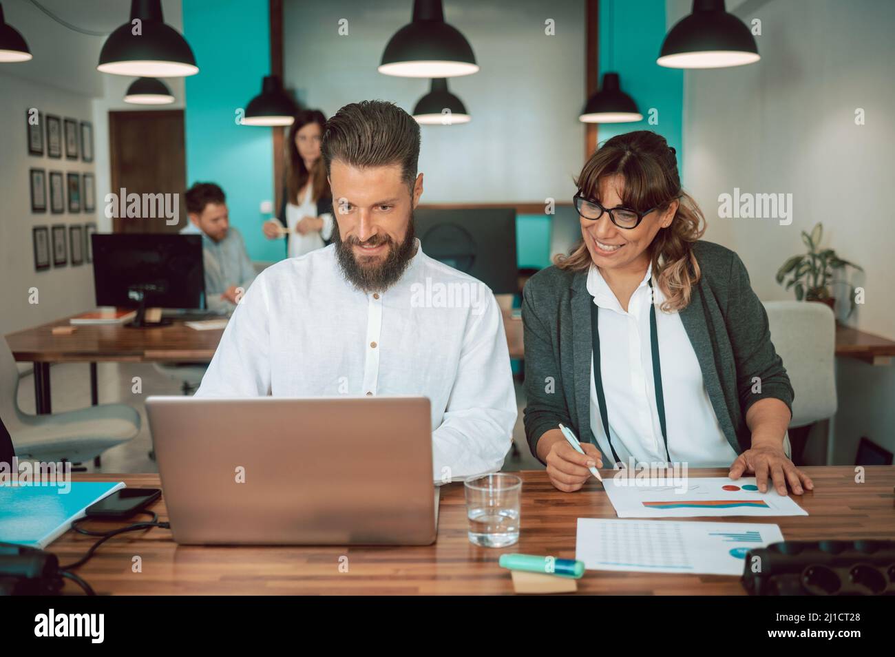Office colleagues collaborate hi-res stock photography and images - Alamy