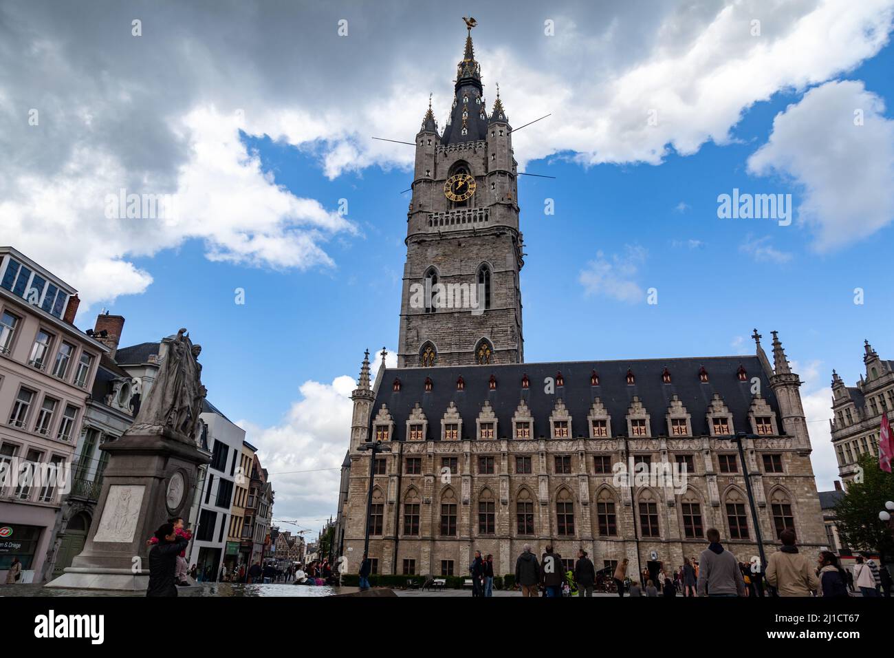 The famous bell tower Het Belfort van Gent in Belgium with a cloudy sky ...