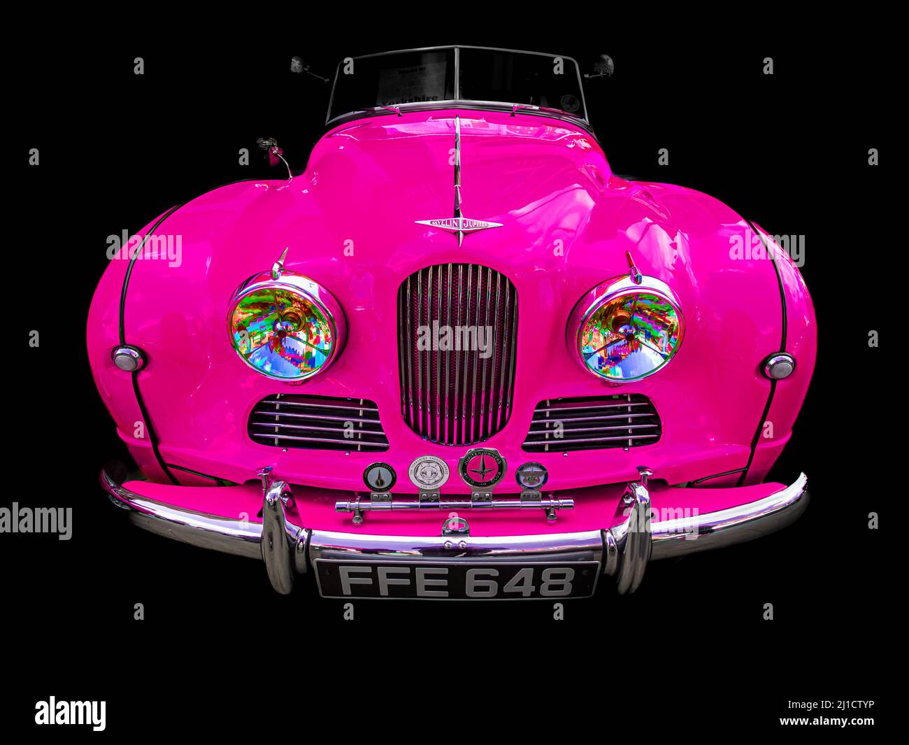 pink classic car on black background Stock Photo - Alamy
