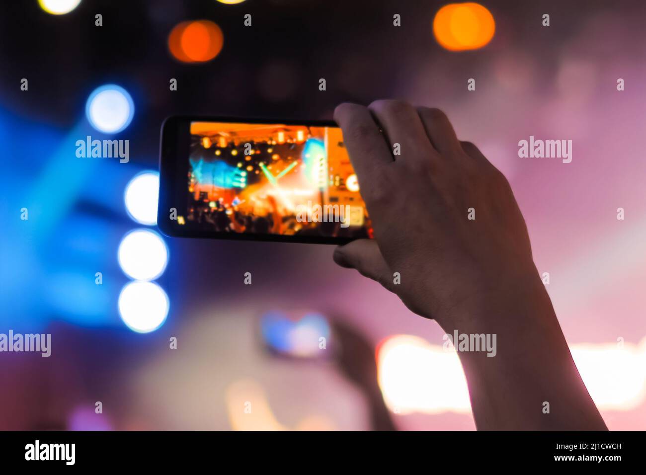 Man hands recording video of live music concert with smartphone Stock ...