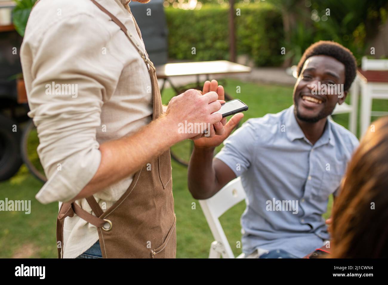 Positive black man browsing social hi-res stock photography and images ...