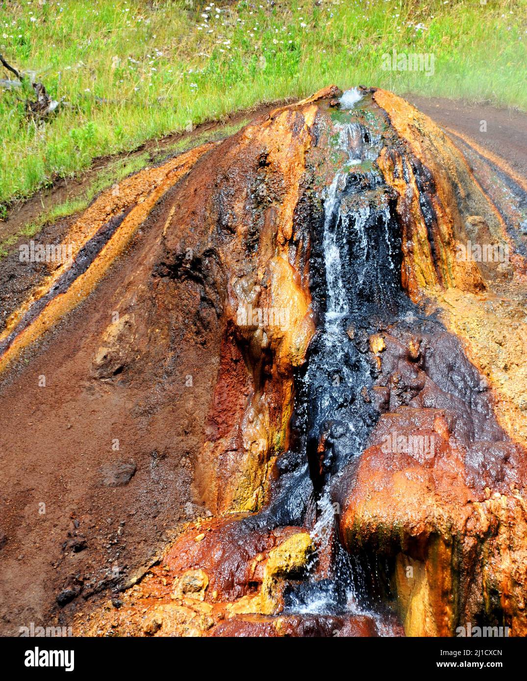 Closeup of Chocolate Pot, in Yellowstone National Park, shows colorful ...