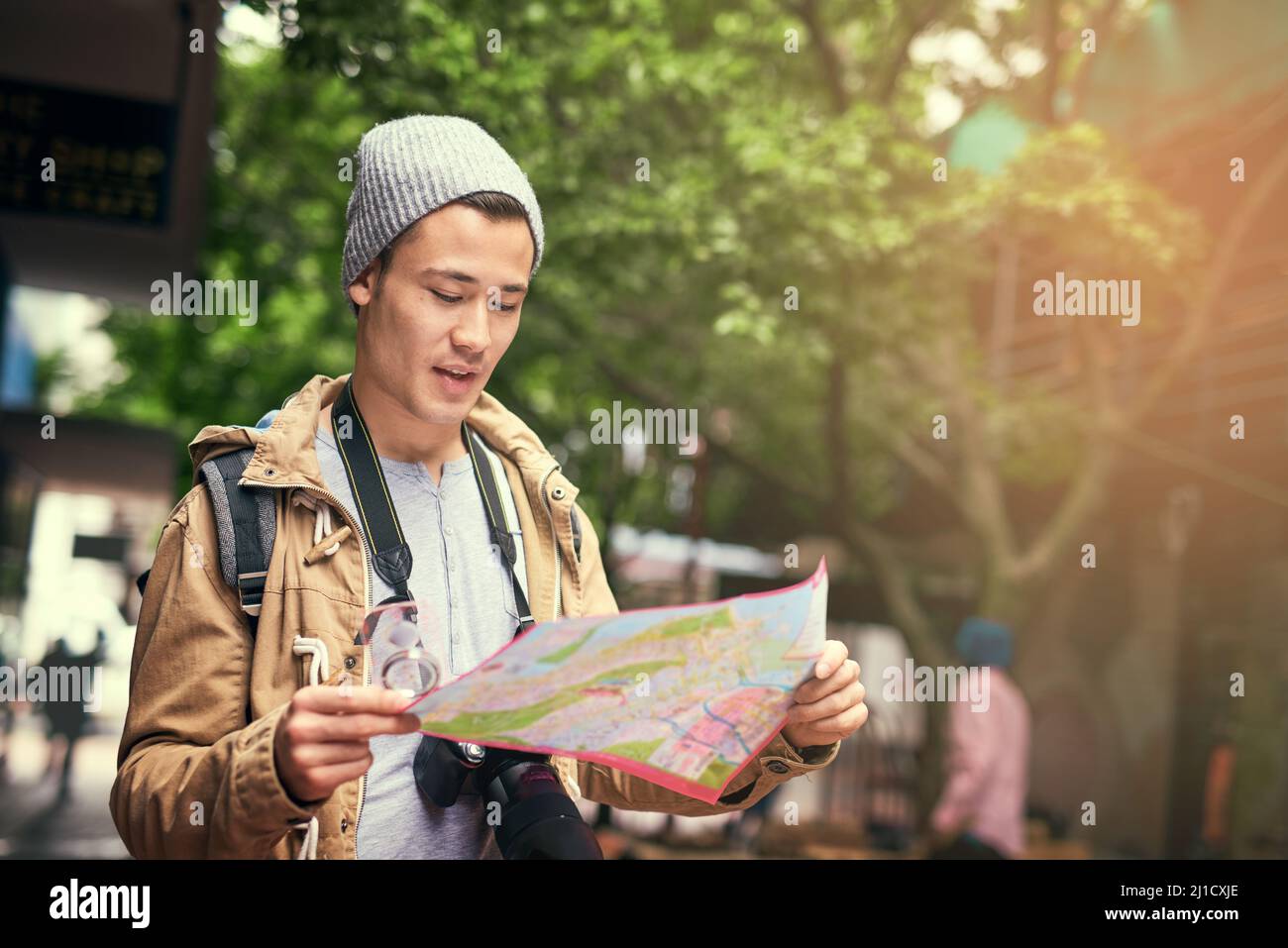 Am I heading in the right direction. Cropped shot of a young man using ...