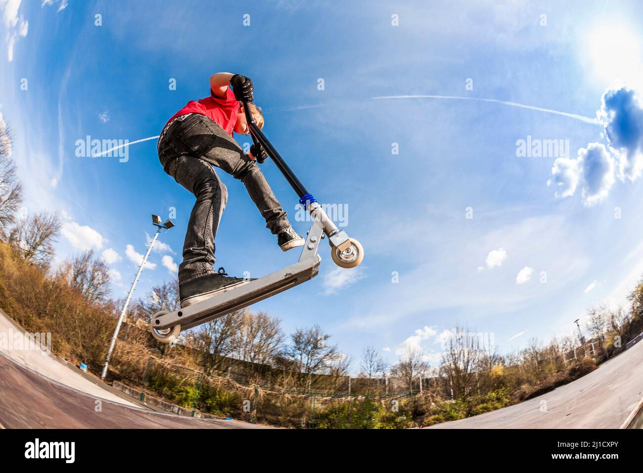 Children play outdoors jumping over hi-res stock photography and images ...