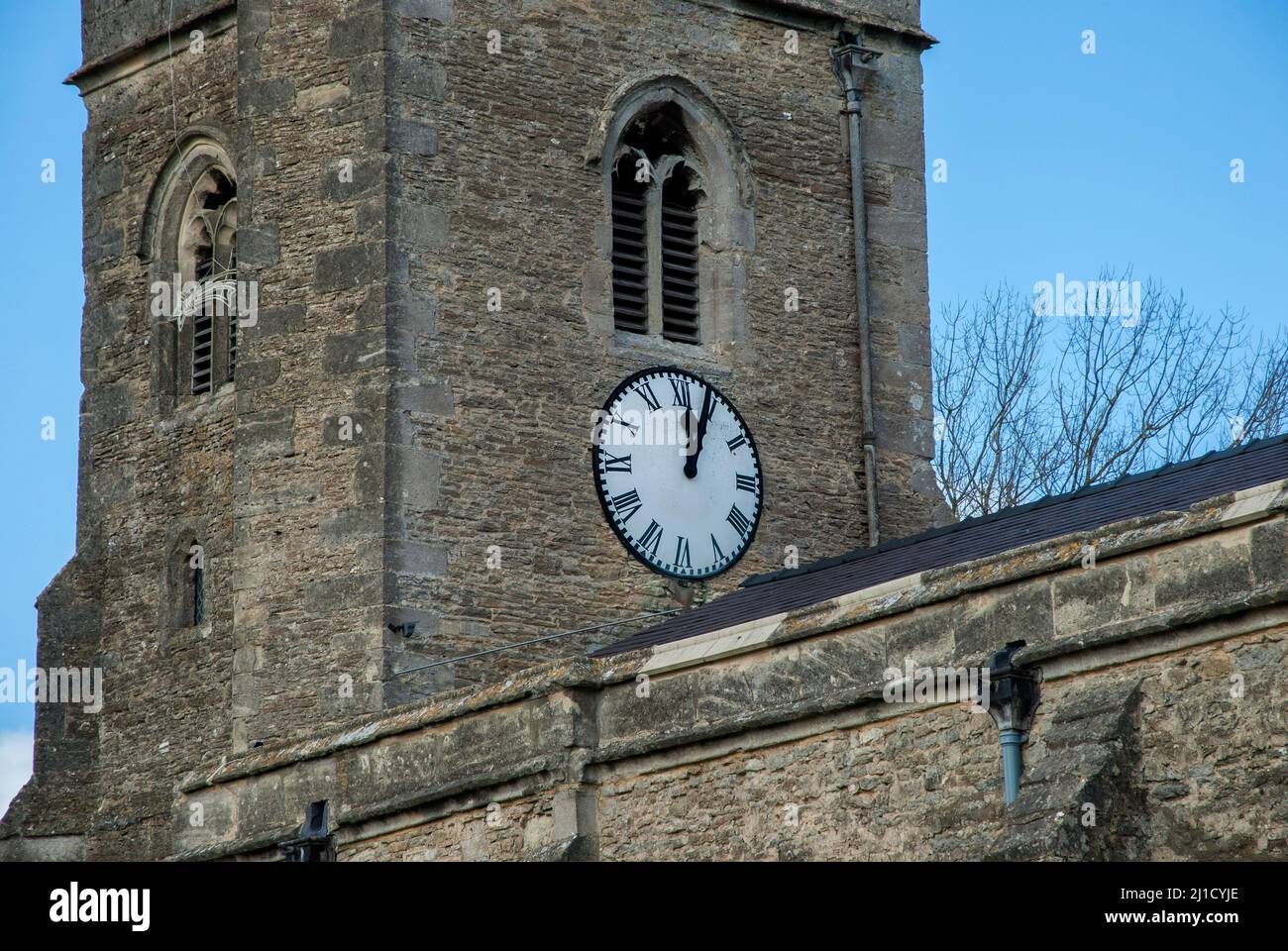 Old stone masonry church tower with clock closeup Stock Photo - Alamy