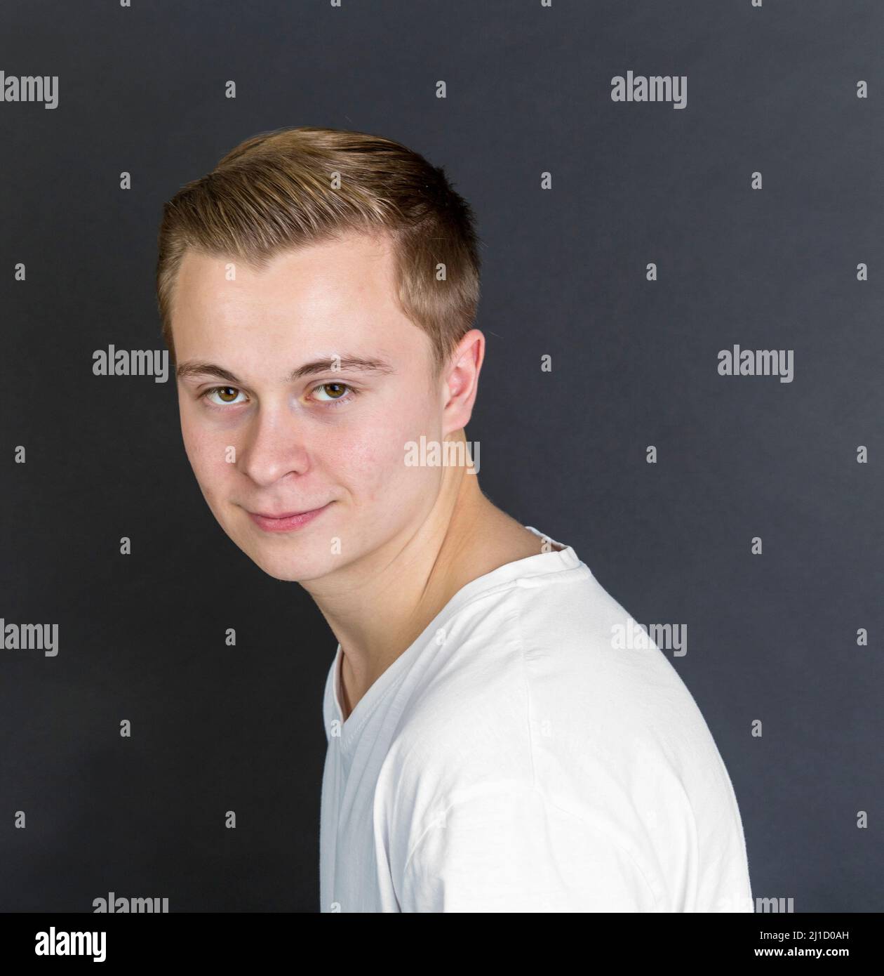 cute smiling teenage boy looks happy and confident Stock Photo - Alamy