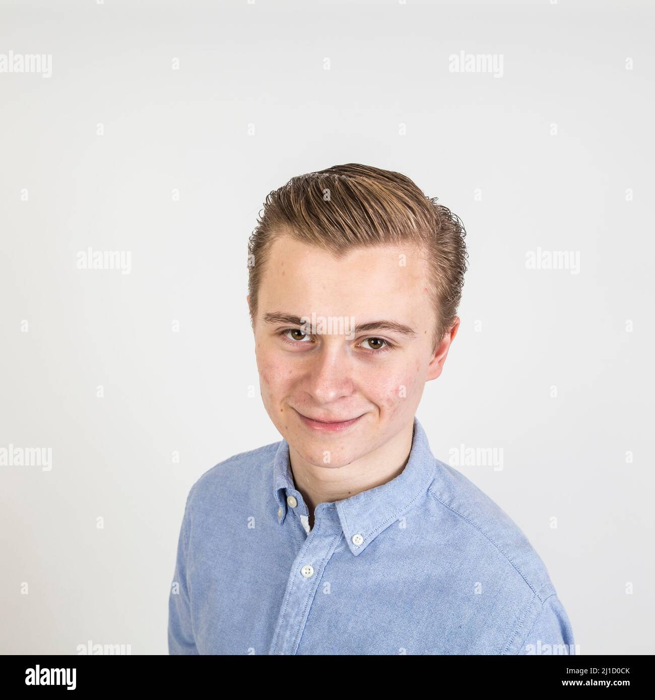 cute smiling teenage boy looks happy and confident Stock Photo - Alamy