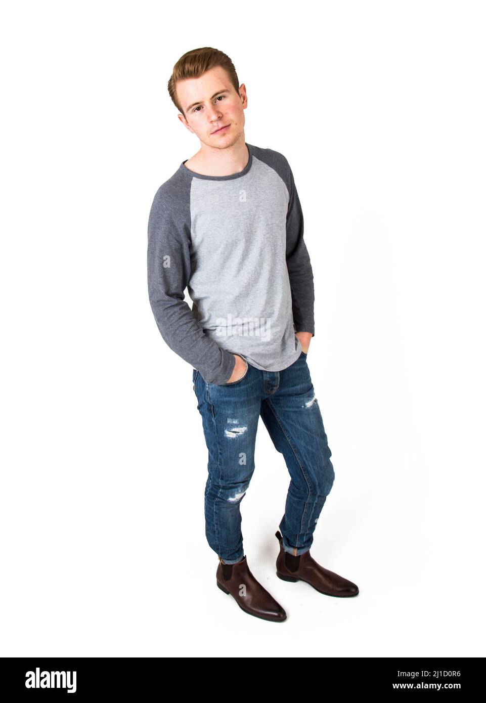 cool boy with cool facial expression poses in studio isolated on white ...