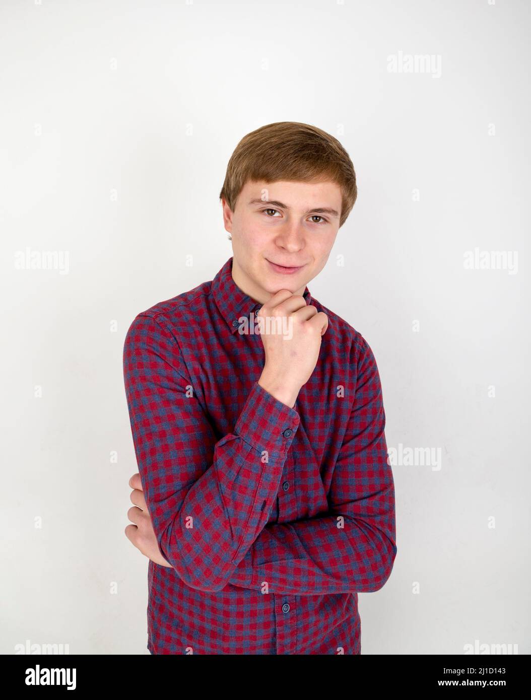 Portrait of thinking handsome young man on white background, cheerful ...