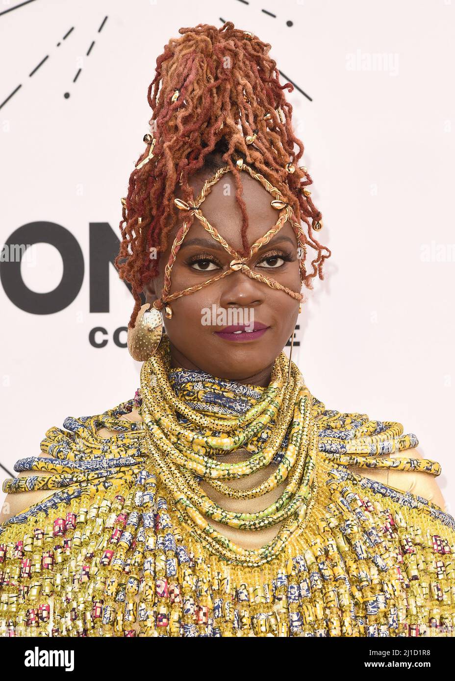 CEO of Essence Caroline Wanga walking on the red carpet at Essence 15th ...