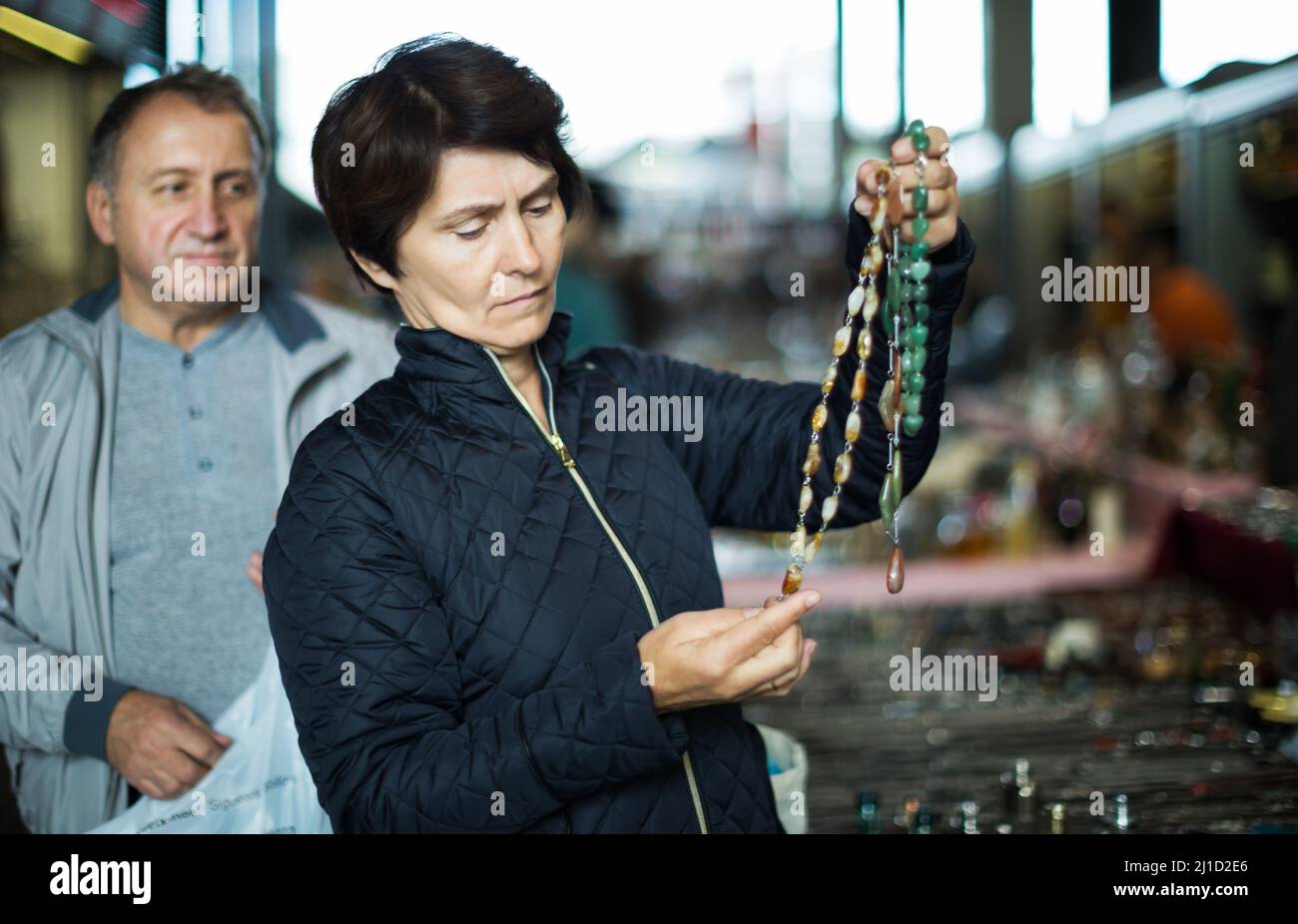 Man and his wife are visiting market of old things Stock Photo - Alamy