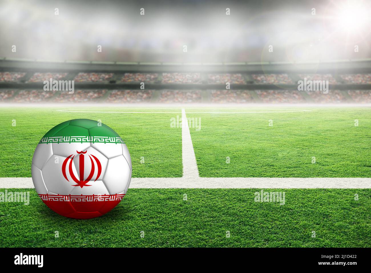 Football in brightly lit outdoor stadium with painted flag of Iran ...