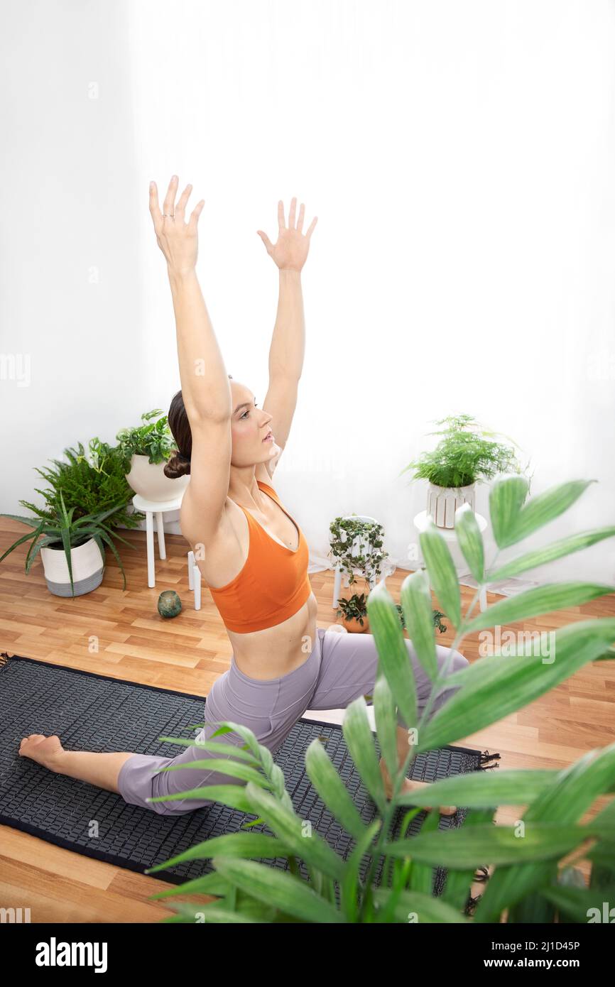 Woman practicing mindful yoga hi-res stock photography and images - Alamy