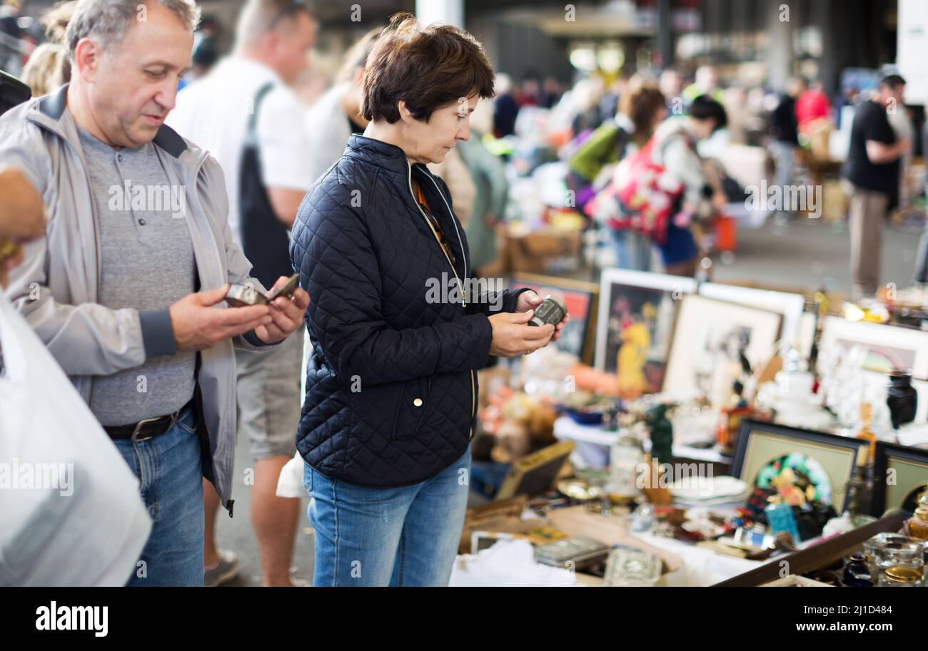 Man and his wife are visiting market of old things Stock Photo - Alamy