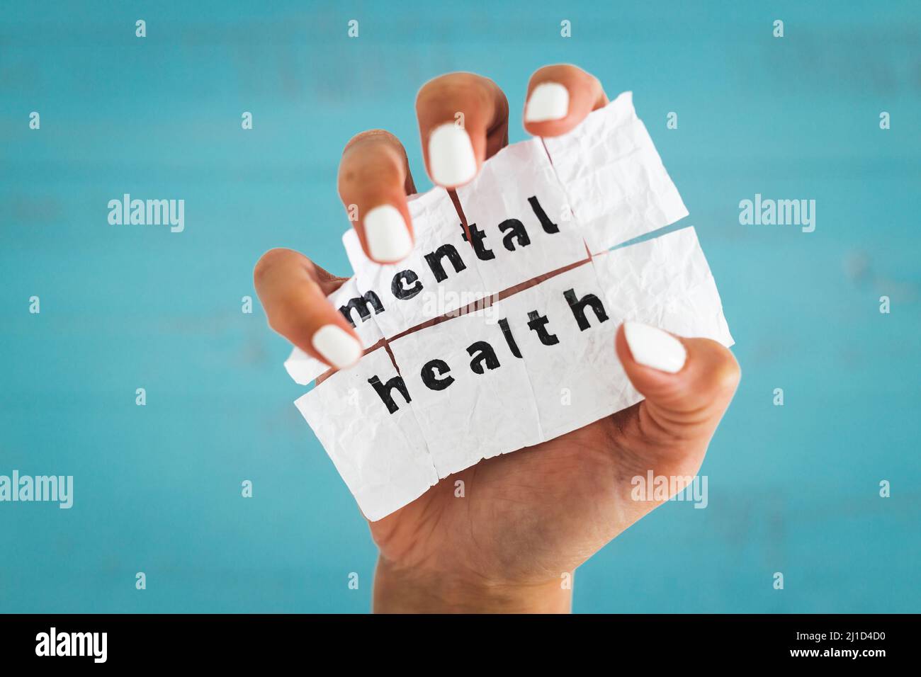 Scrunched up paper hand hi-res stock photography and images - Alamy